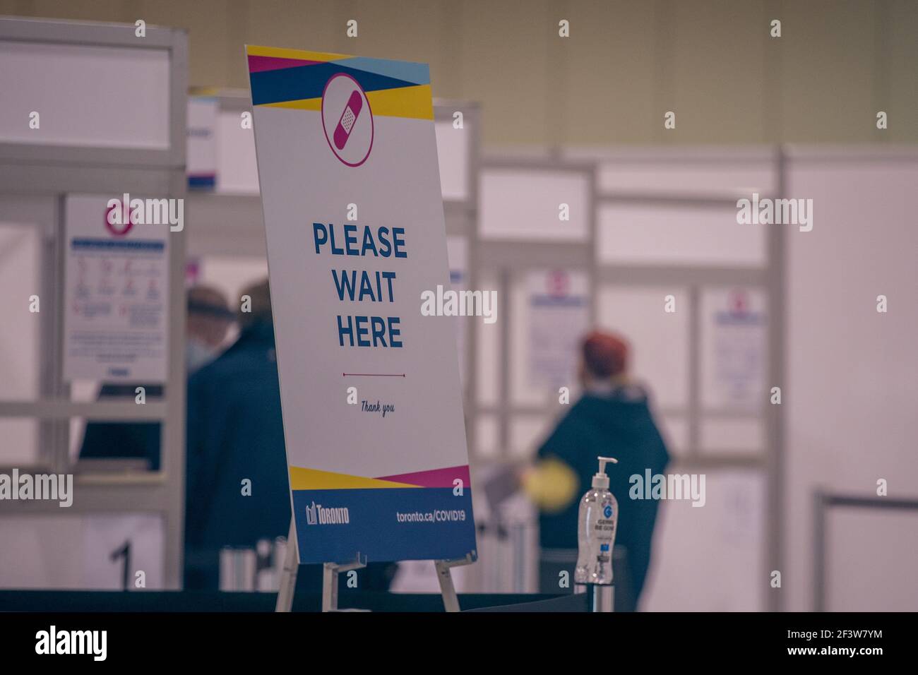 A 'please wait here' sign seen inside a Metro Convention Centre in ...