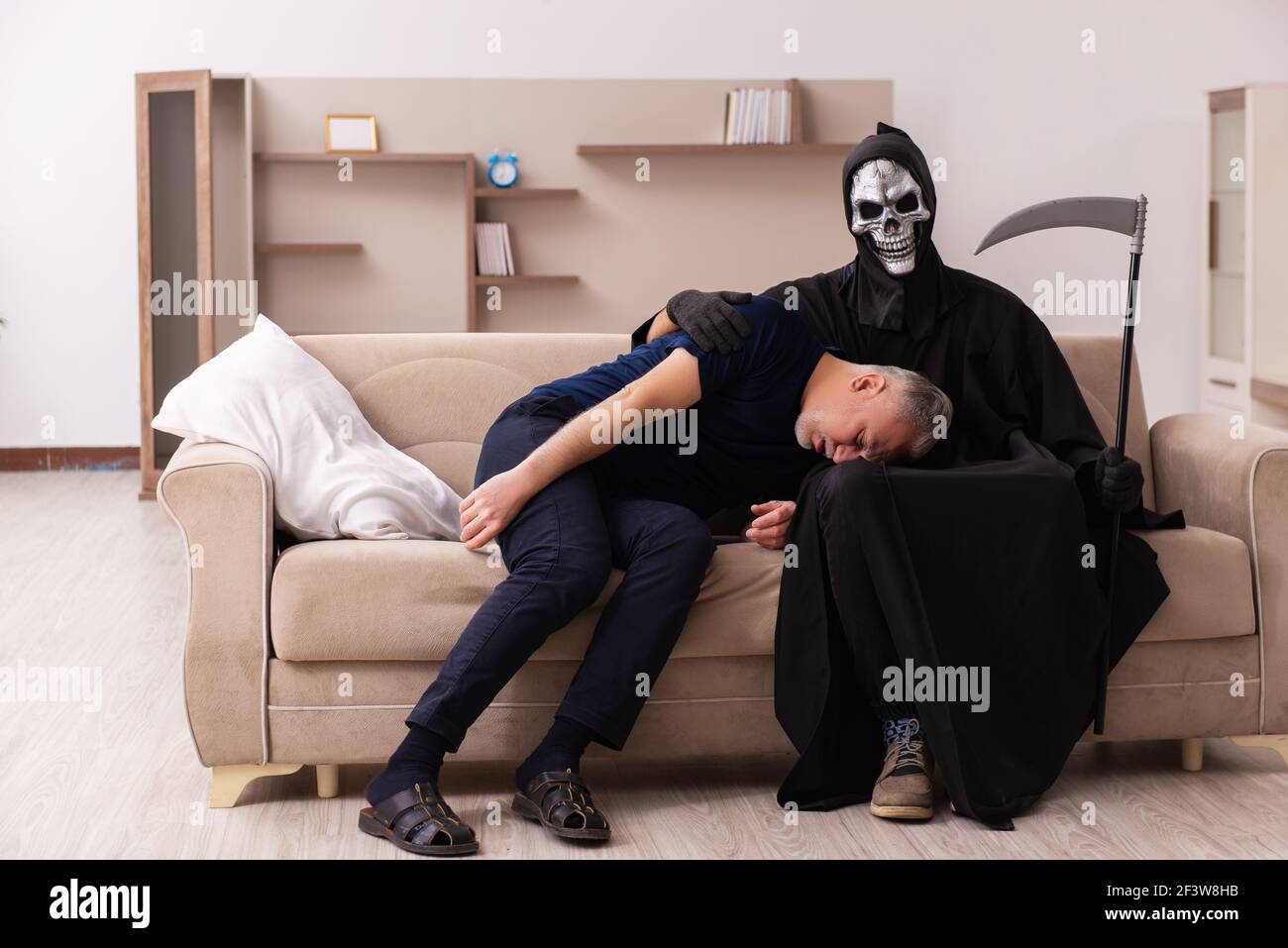 Devil coming to old dying man Stock Photo - Alamy