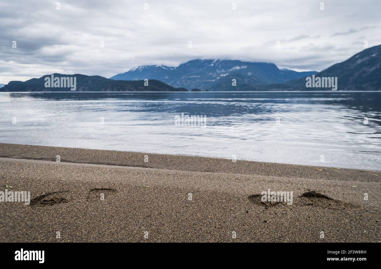 footsteps on beach, Harrison Lake, Harrison Hot Springs, British ...