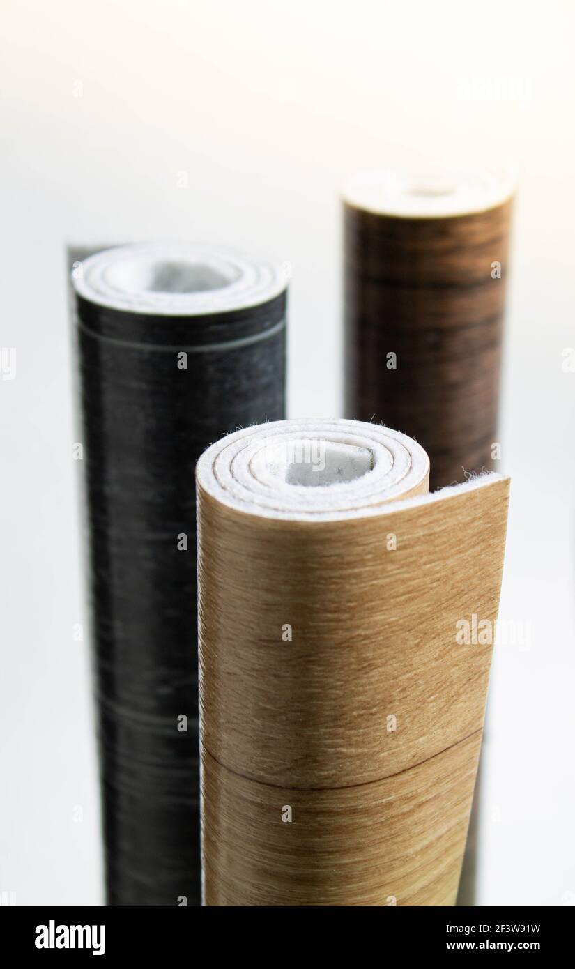 Linoleum. Three rolls of linoleum on a white background. Floor ...