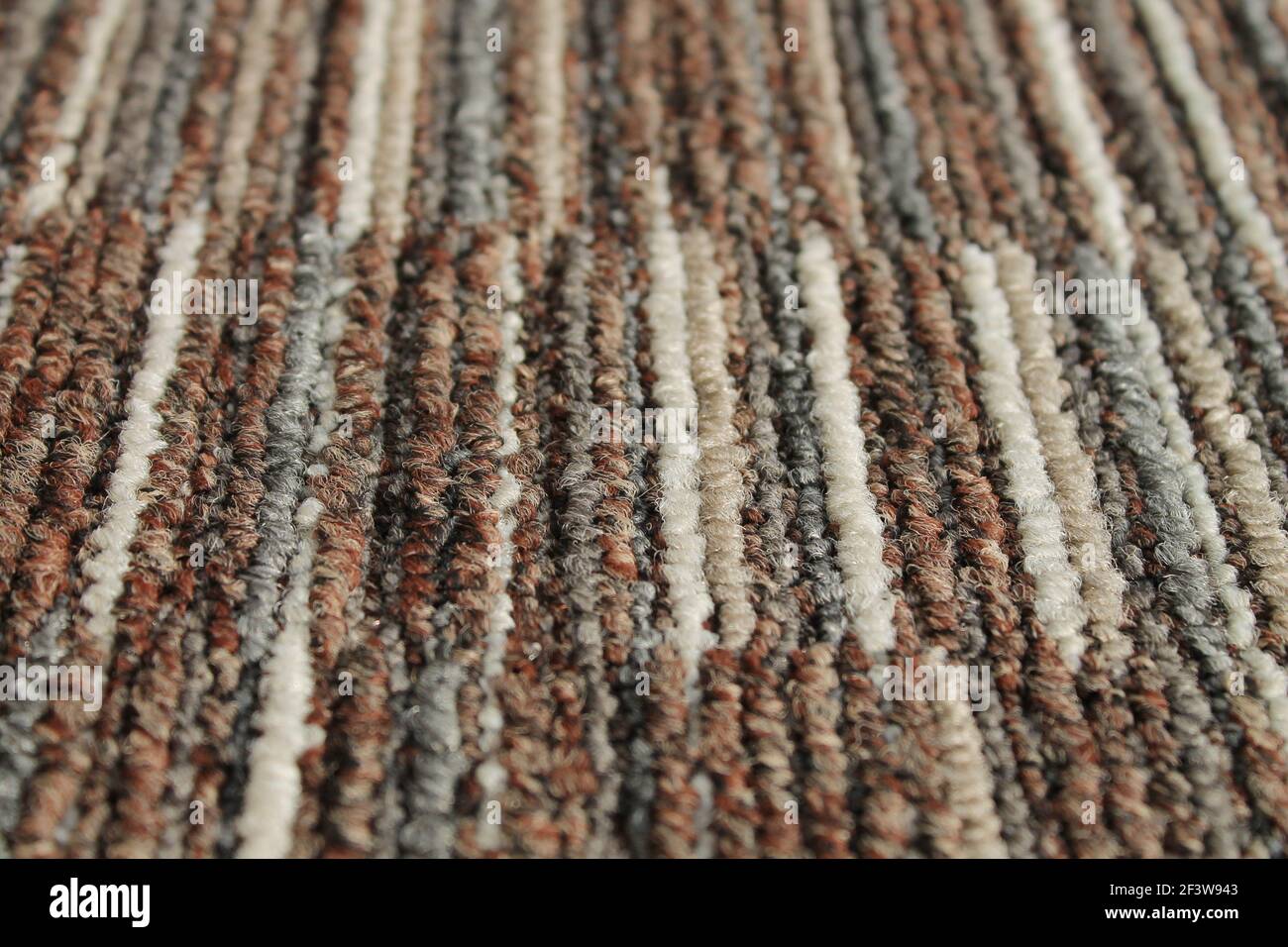 Texture of carpet floor close-up. Brown carpet with a pattern ...