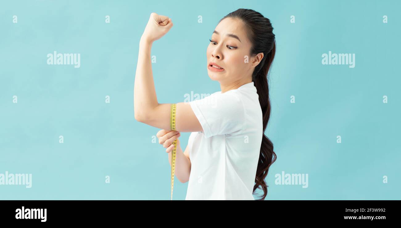 fat woman, woman hand pinching on her excessive fat arm with measure ...