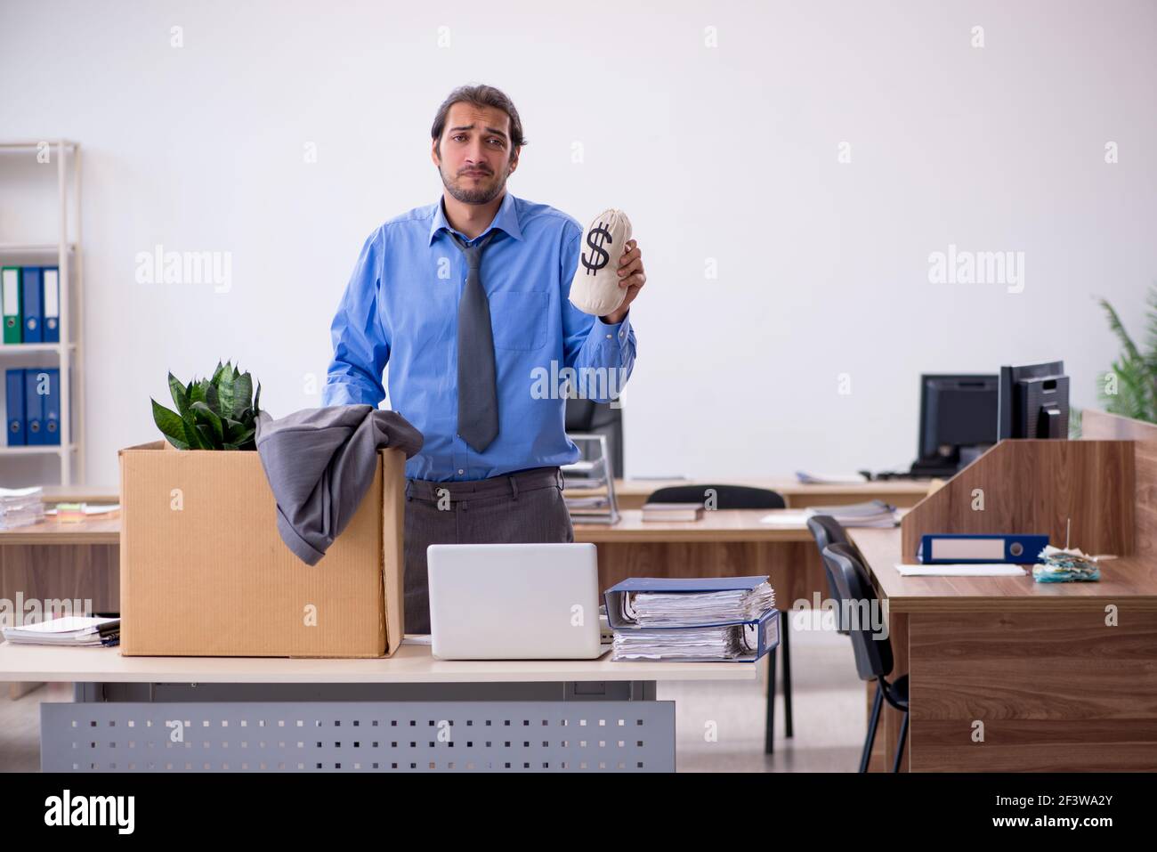 Young employee being fired from his work Stock Photo - Alamy