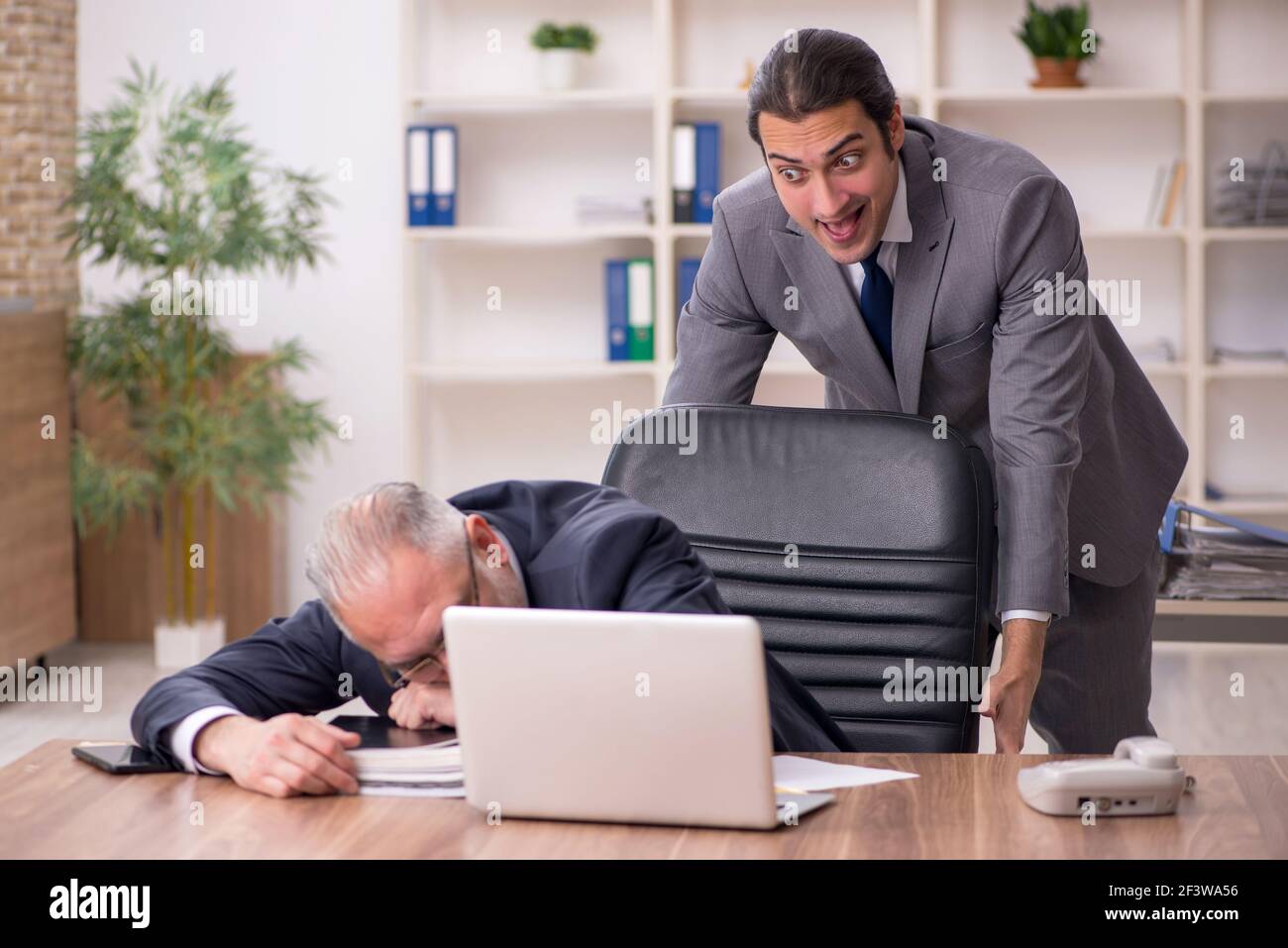 Bad teamwork tired manager sleep at work desk angry colleagues hi-res ...