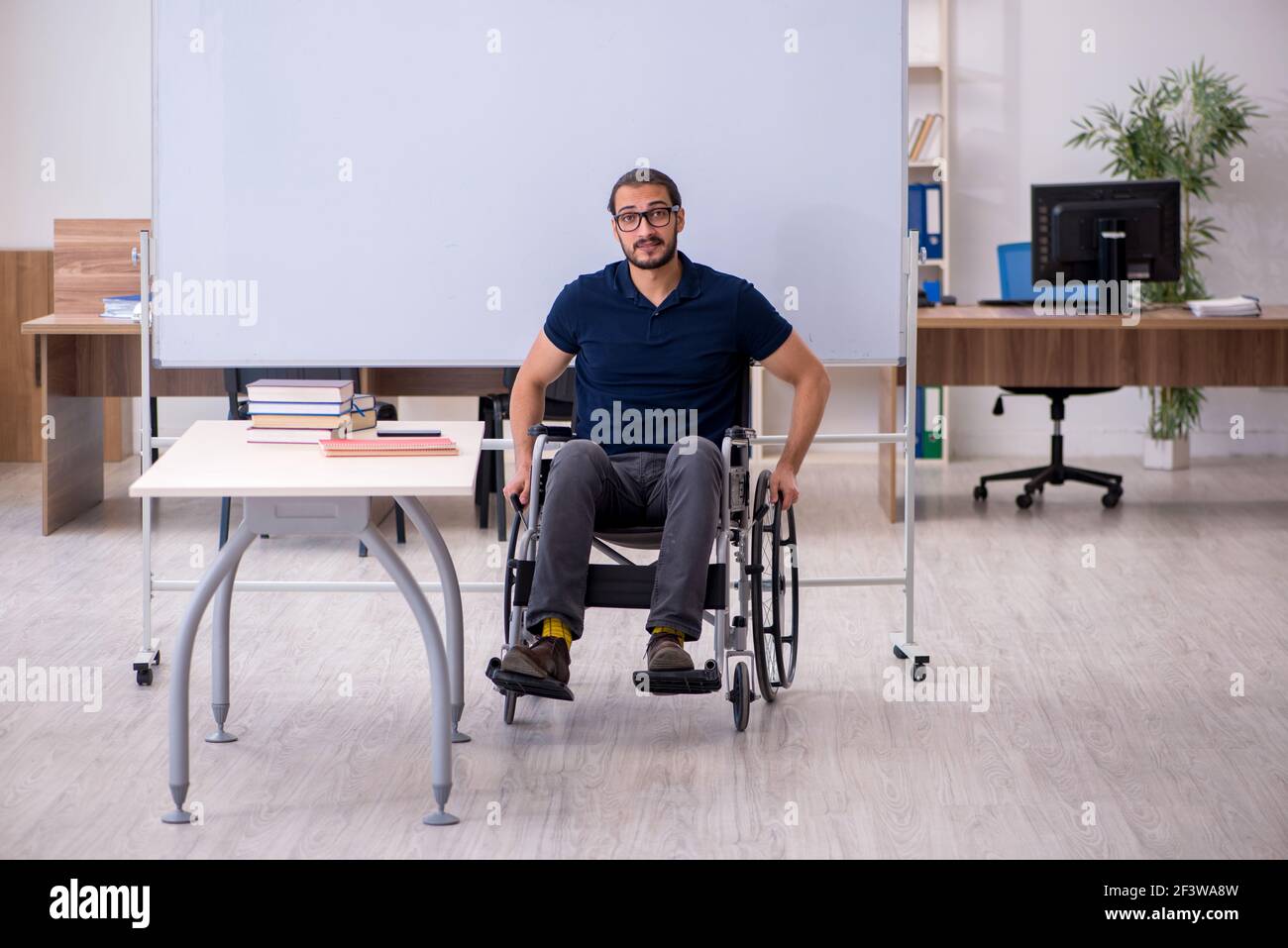 Young handicapped student in the classroom Stock Photo - Alamy