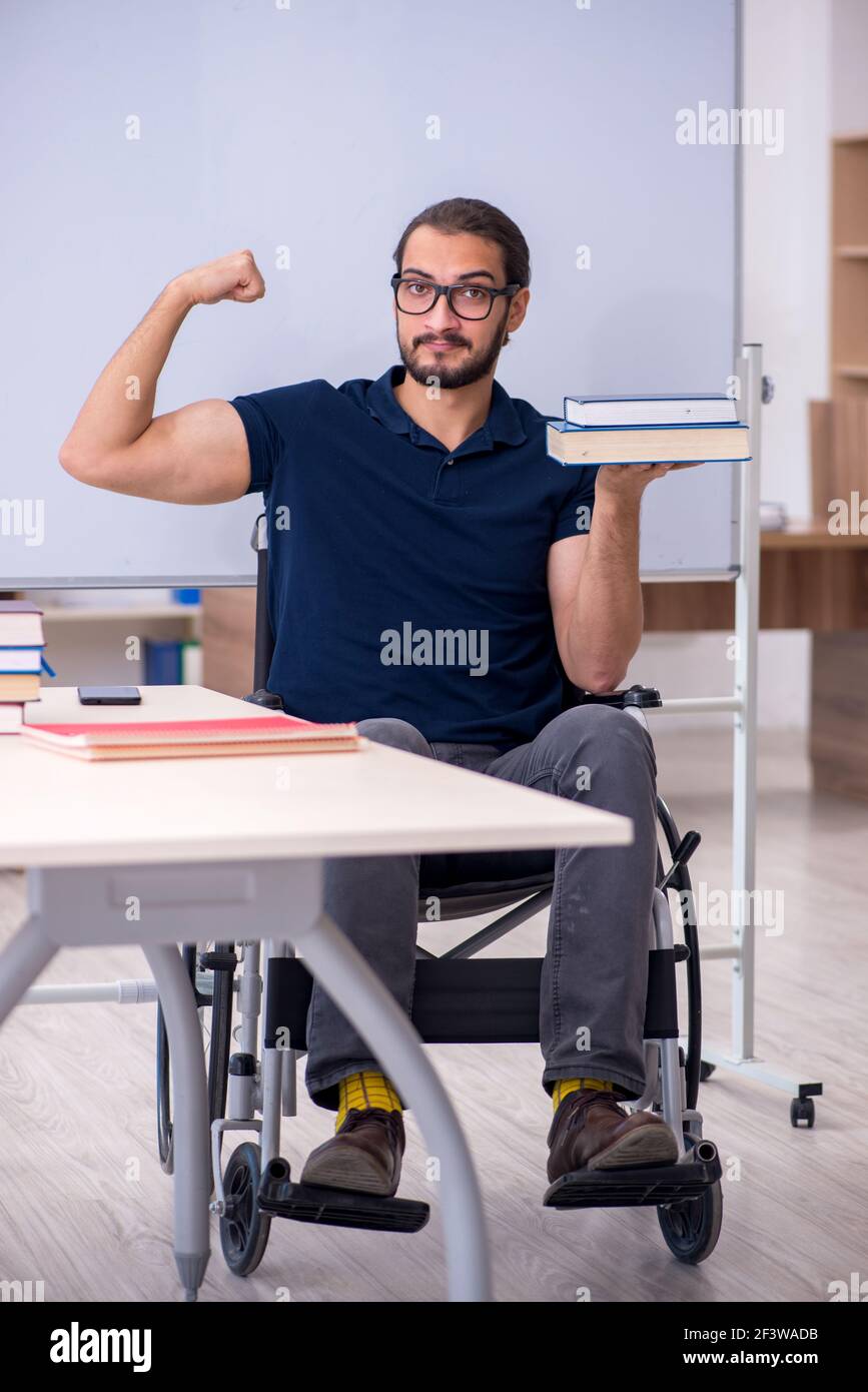 Young handicapped student in the classroom Stock Photo - Alamy