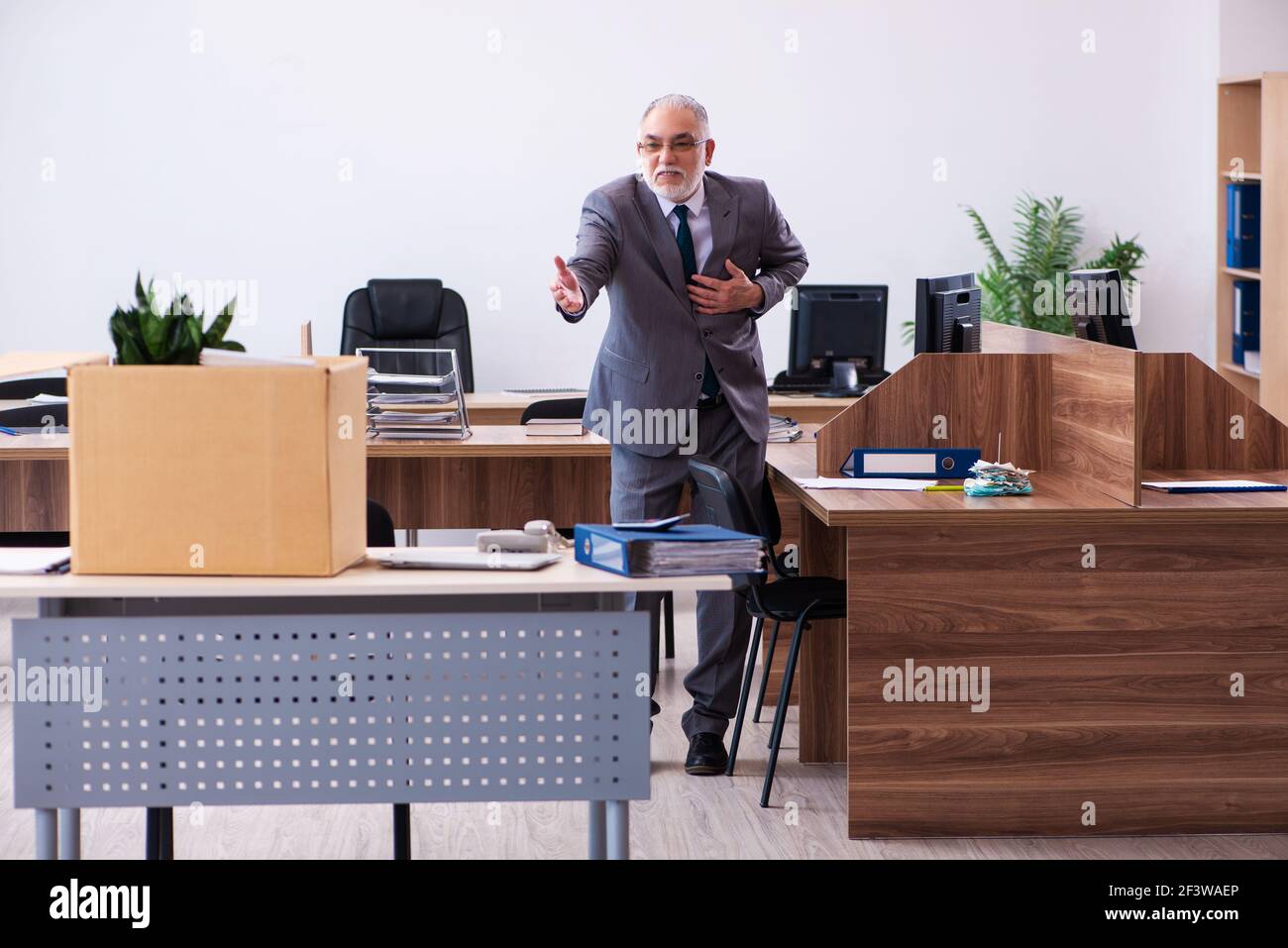 Old employee being fired from his work Stock Photo - Alamy