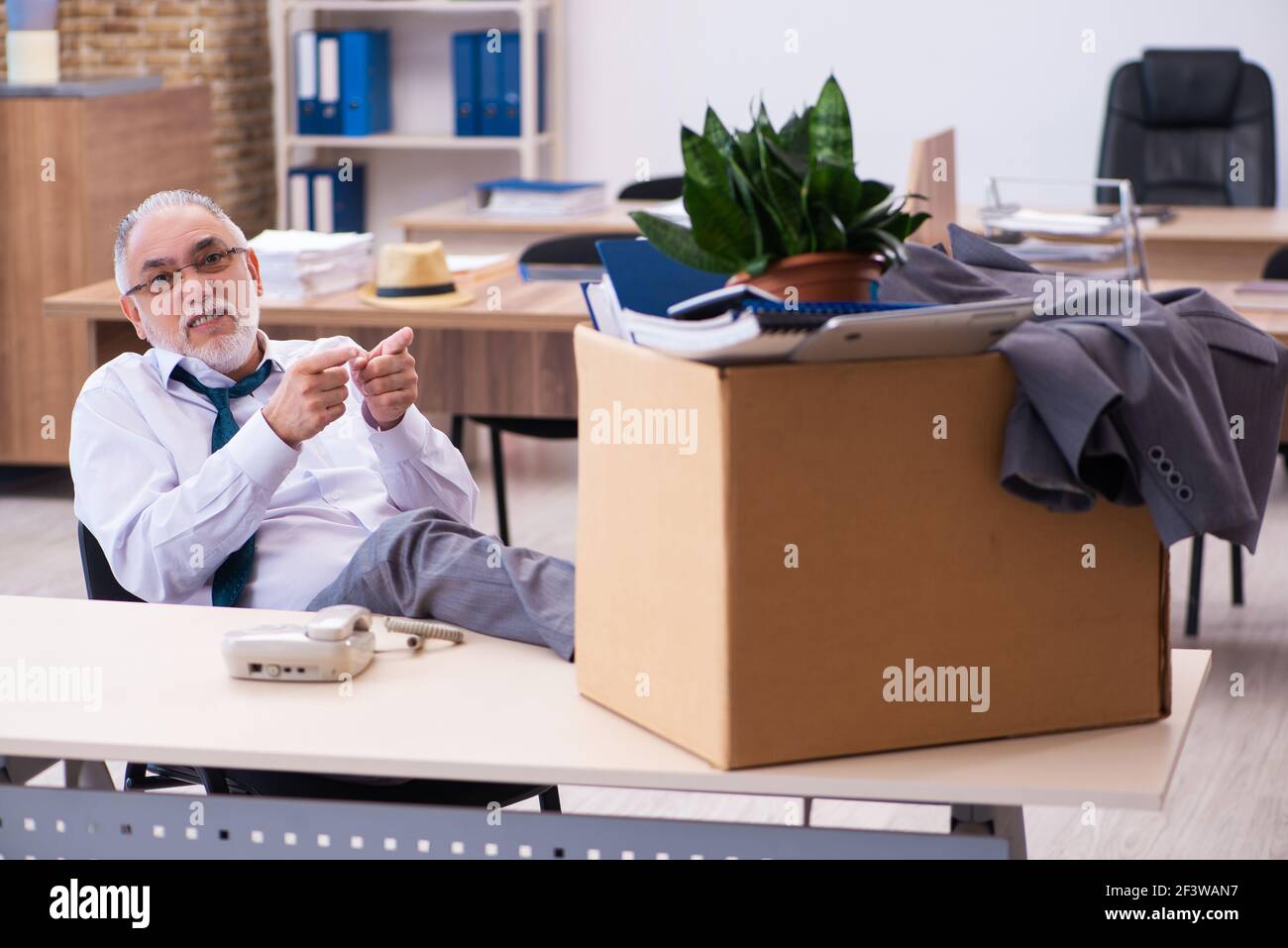 Old employee being fired hi-res stock photography and images - Alamy
