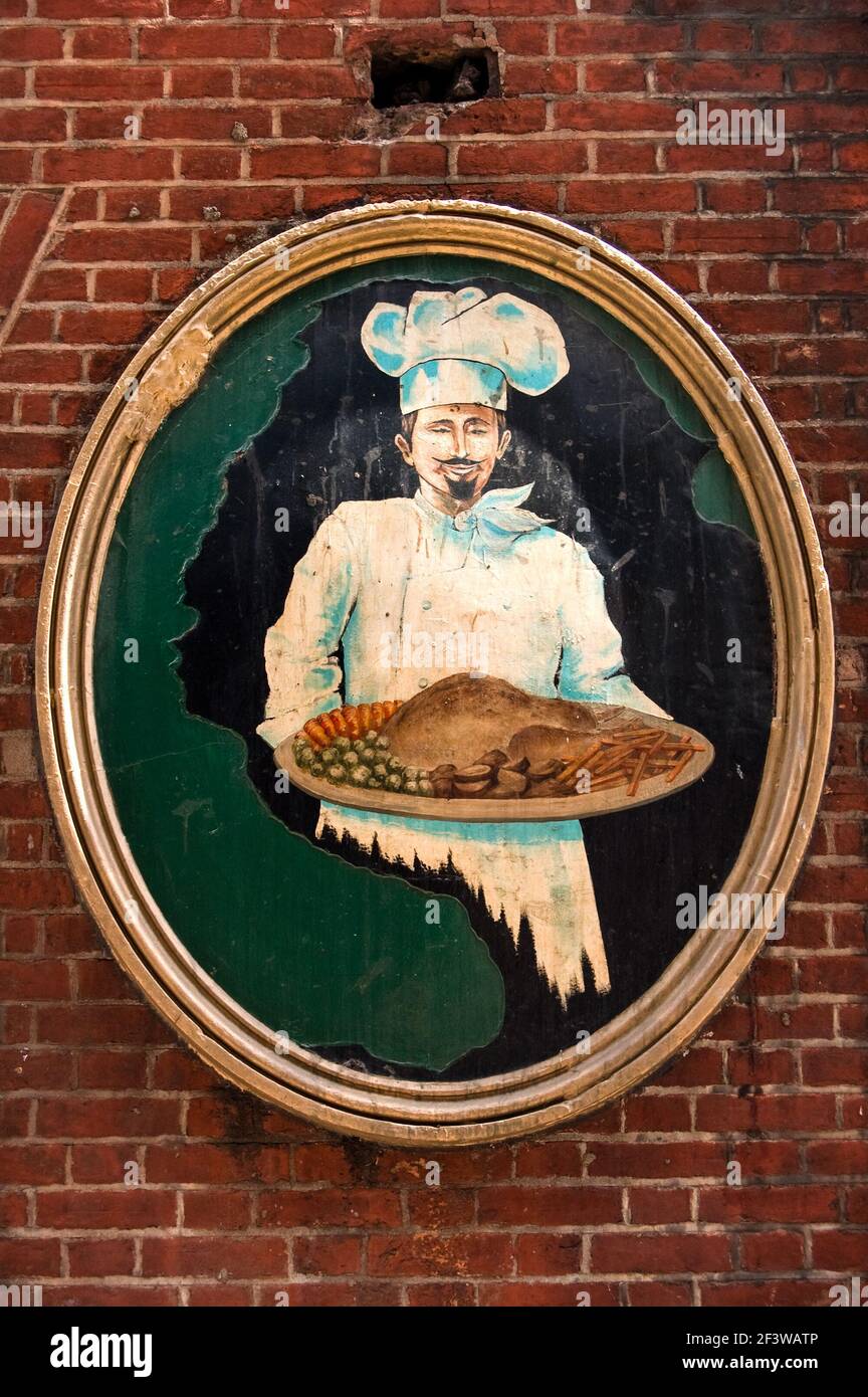 old sign showing chef with roast dinner, Dublin, Ireland Stock Photo ...