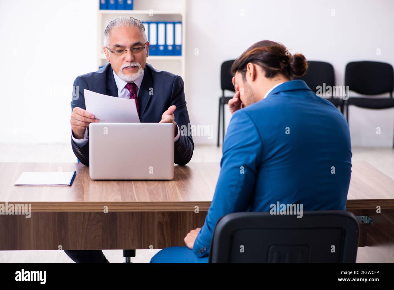 Male candidate employee meeting with old recruiter Stock Photo - Alamy