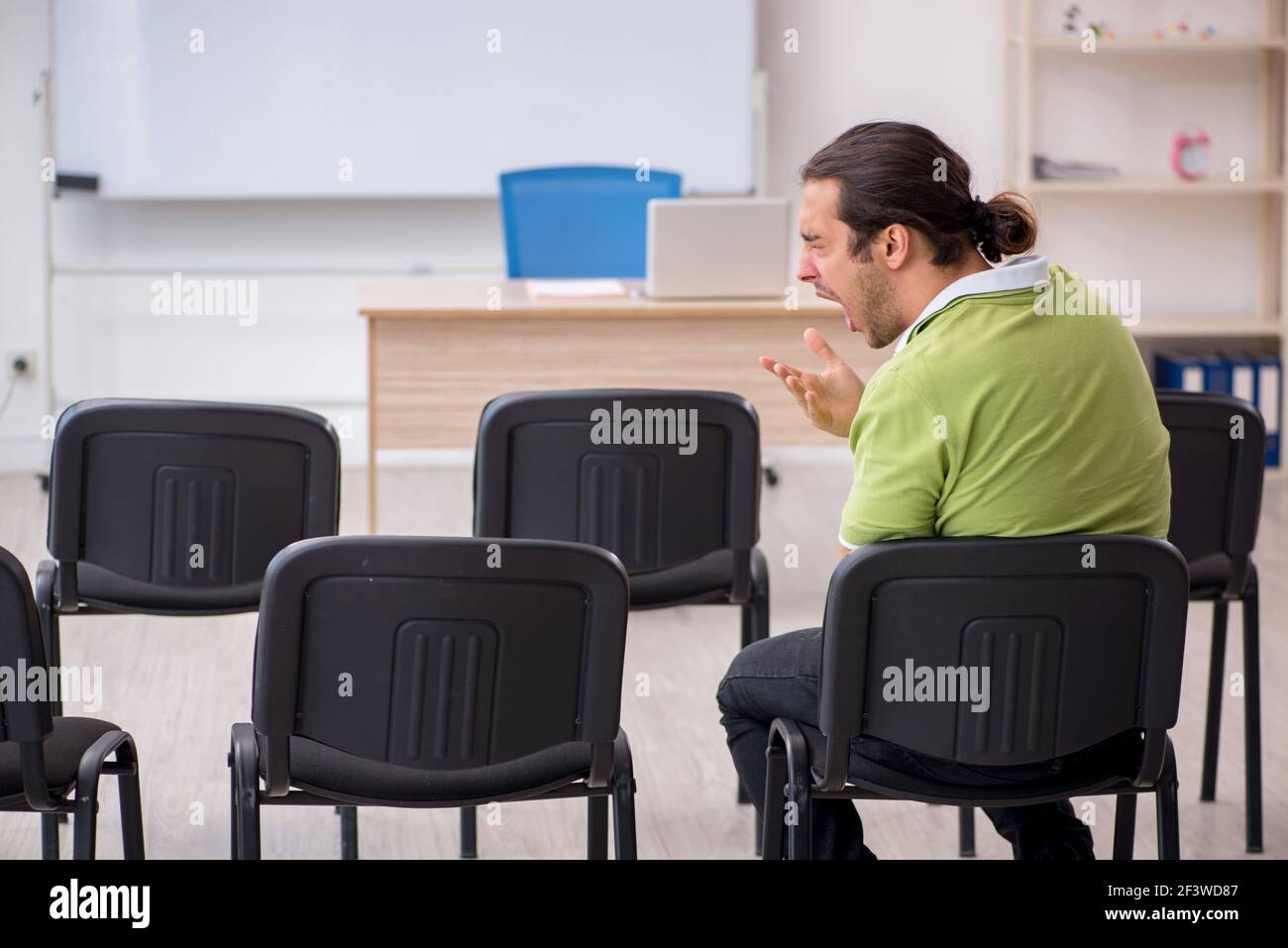 Young student in business presentation concept Stock Photo - Alamy