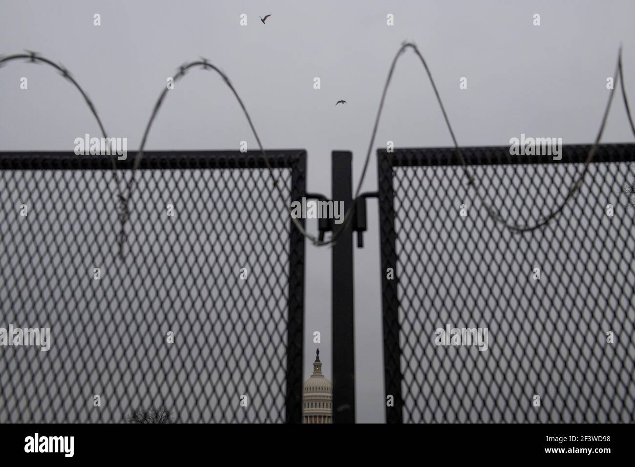 The iron, barbed wire-topped barrier fence still surrounds the U.S ...