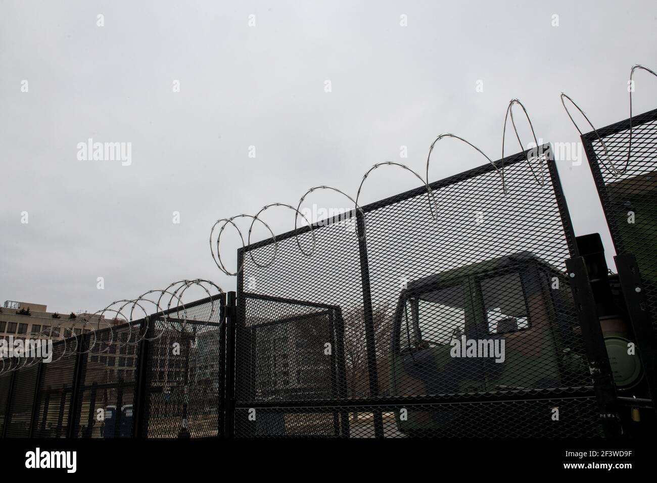 The iron, barbed wire-topped barrier fence still surrounds the U.S ...