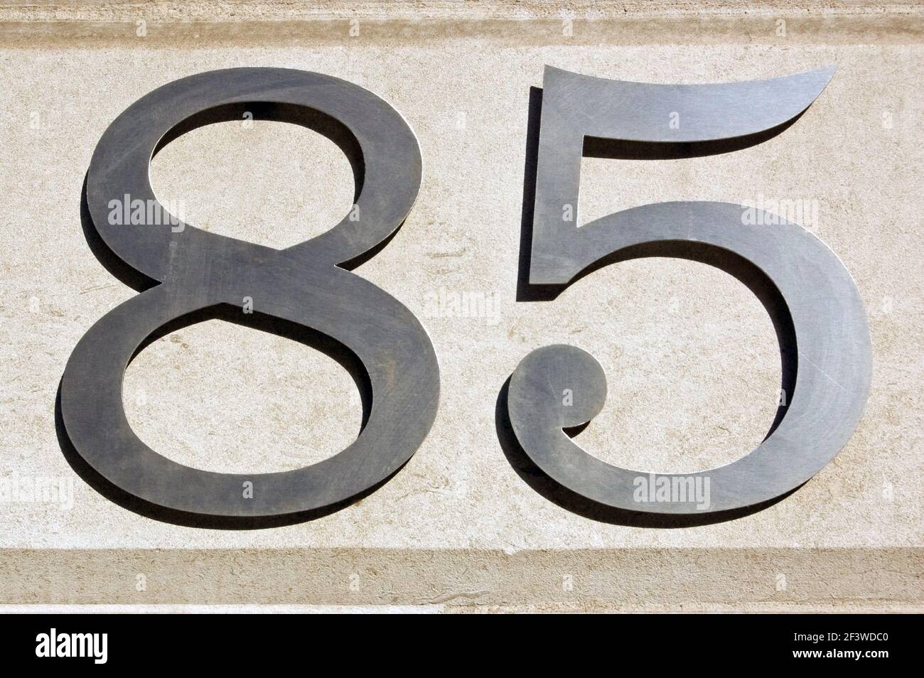 Number eighty five sign on the outside of an office building in central ...