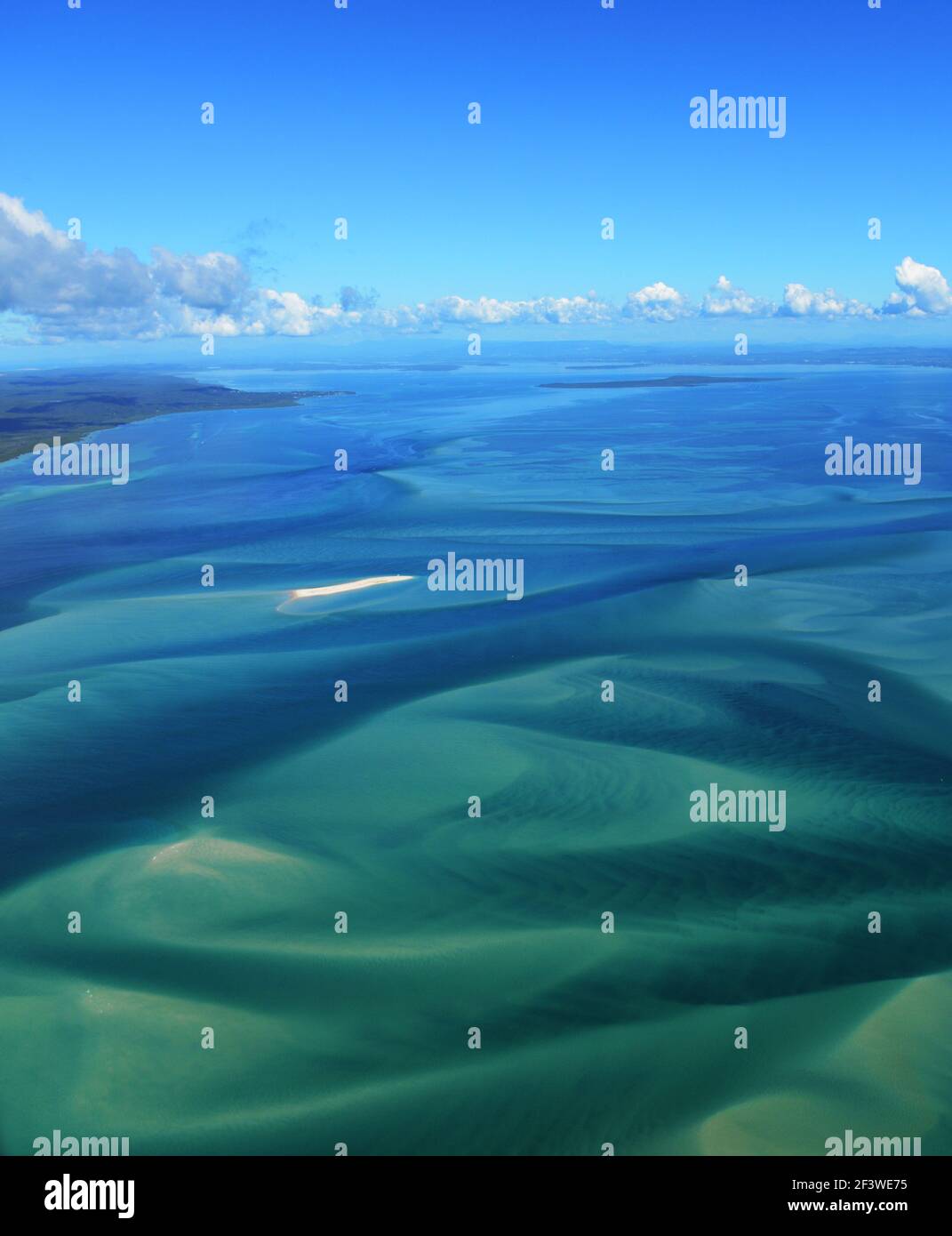 A mosaic of ocean colors as seen from above the Coral Sea in Queensland ...