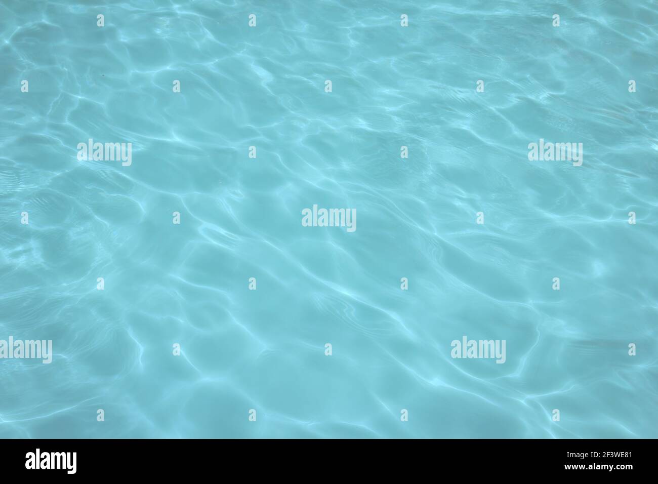 swimming pool with sunny reflections background Stock Photo - Alamy
