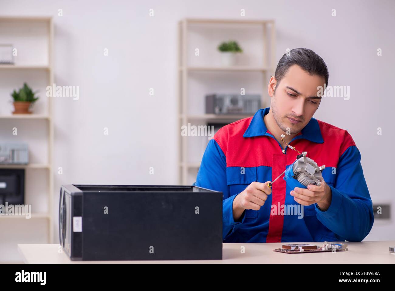 Man repairing device cooling hi-res stock photography and images - Alamy