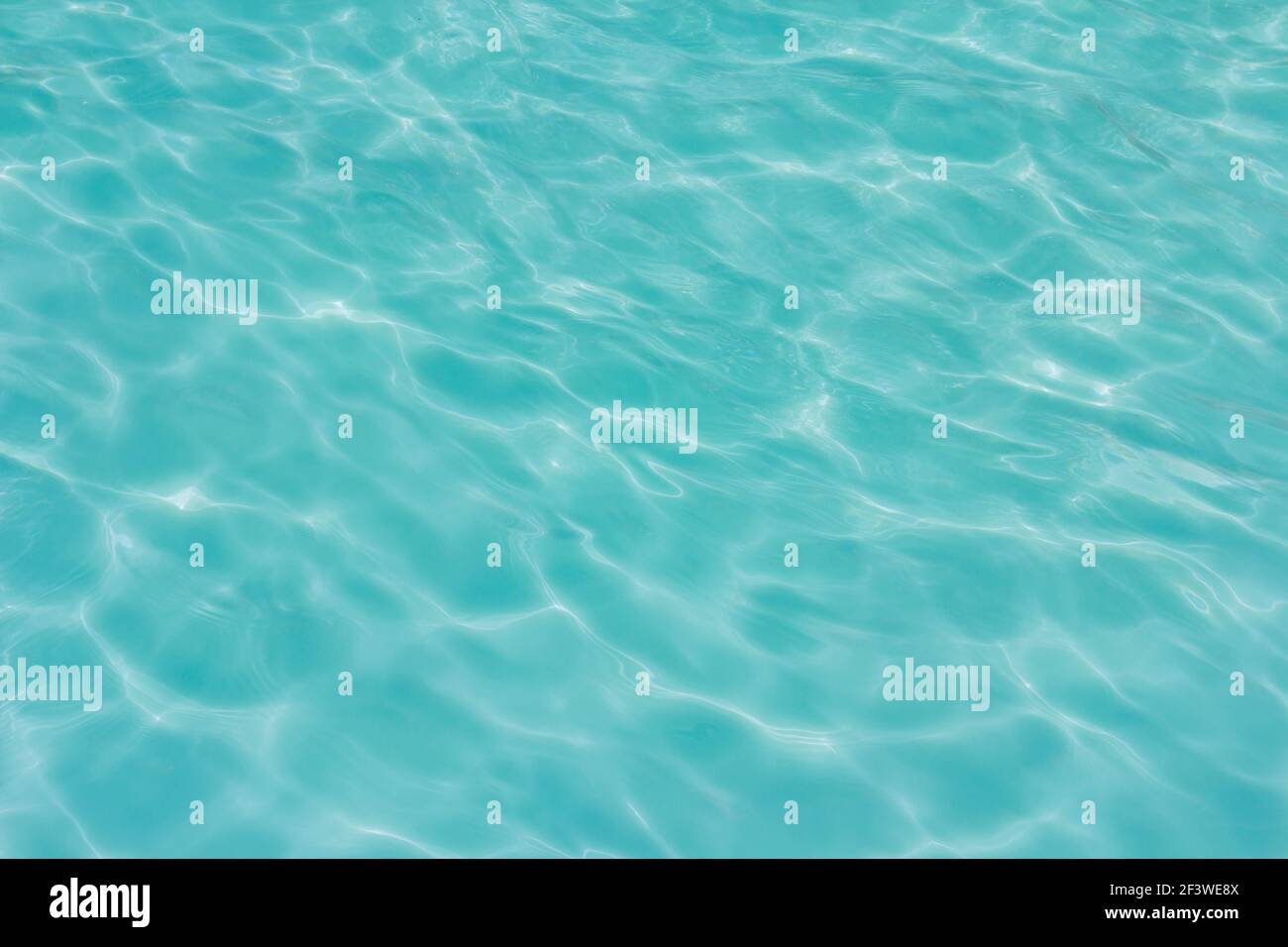 swimming pool with sunny reflections background Stock Photo - Alamy
