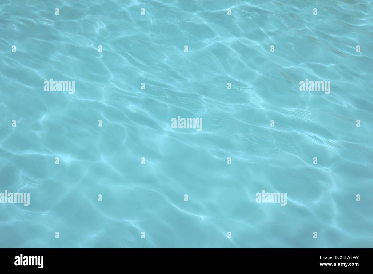 swimming pool with sunny reflections background Stock Photo - Alamy