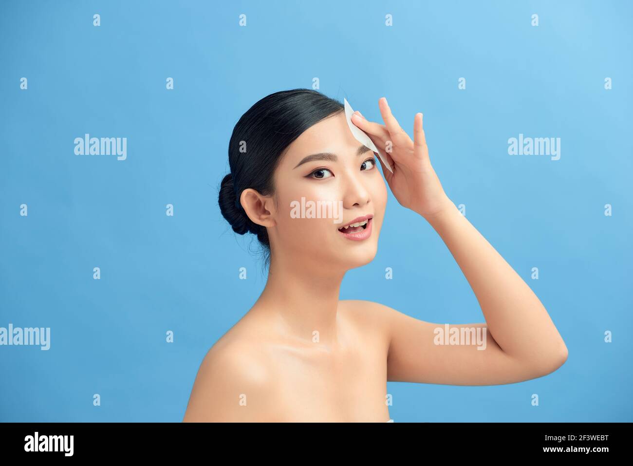 Woman blotting face hi-res stock photography and images - Alamy