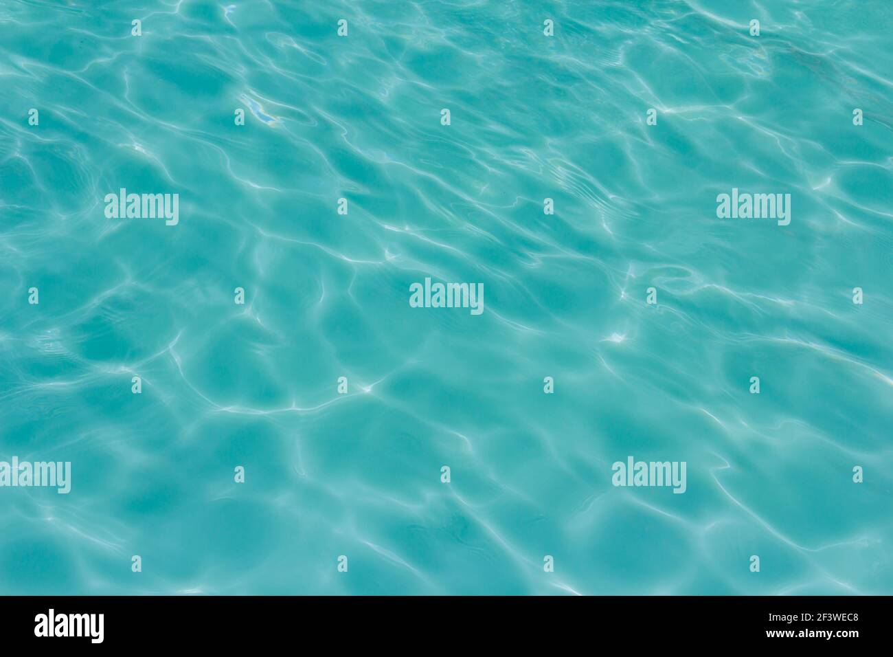 swimming pool with sunny reflections background Stock Photo - Alamy