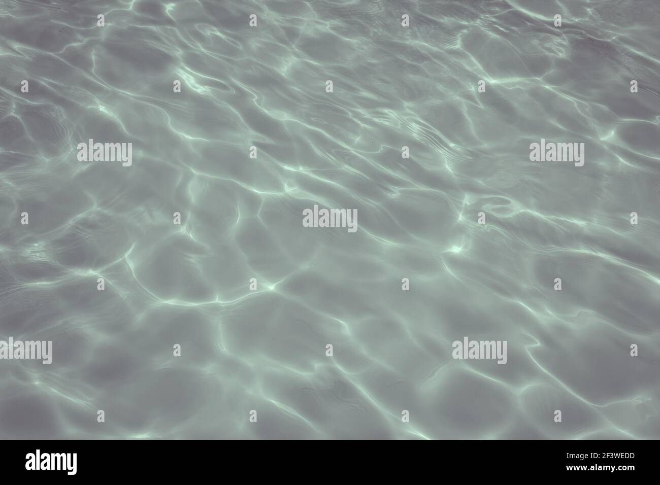 swimming pool with sunny reflections background Stock Photo - Alamy