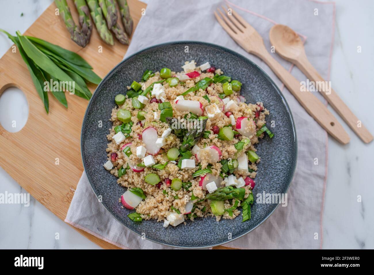 healthy spring couscous salad with asparagus and herbs Stock Photo - Alamy