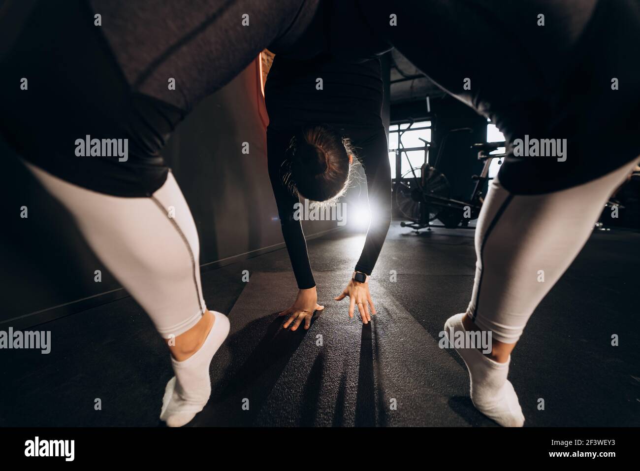 Slim athletic woman doing exercise bridge at gym Stock Photo - Alamy