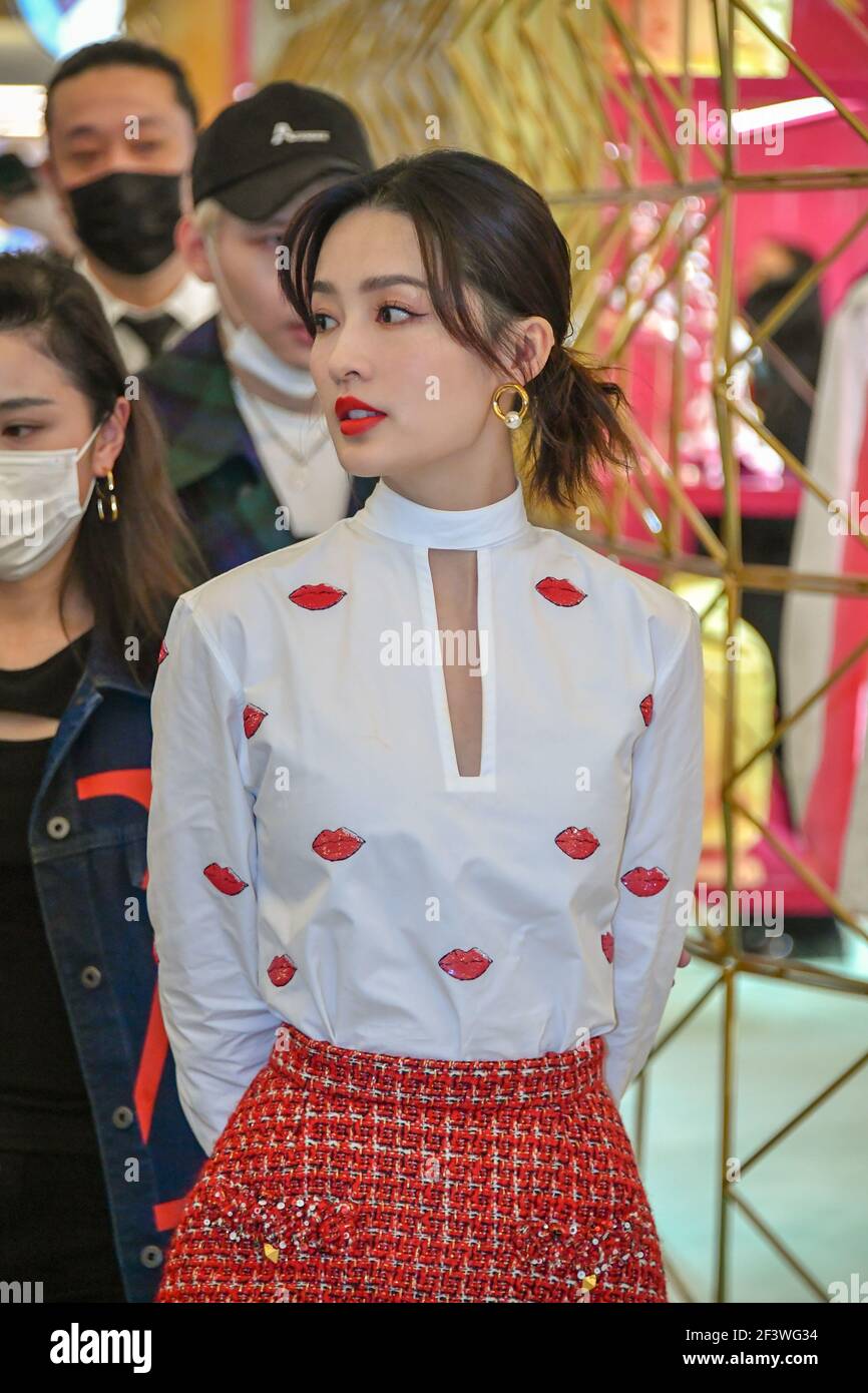 Chinese actress Li Qin, stands for a Valentino event in Shanghai, China ...