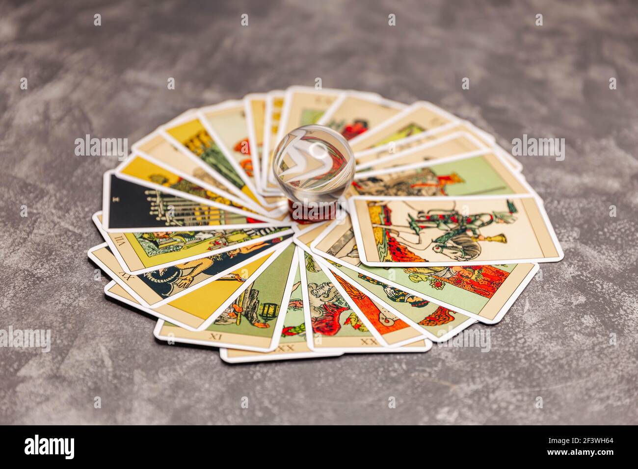 Set of tarot cards on the table. Tarot cards and magic crystal ball ...