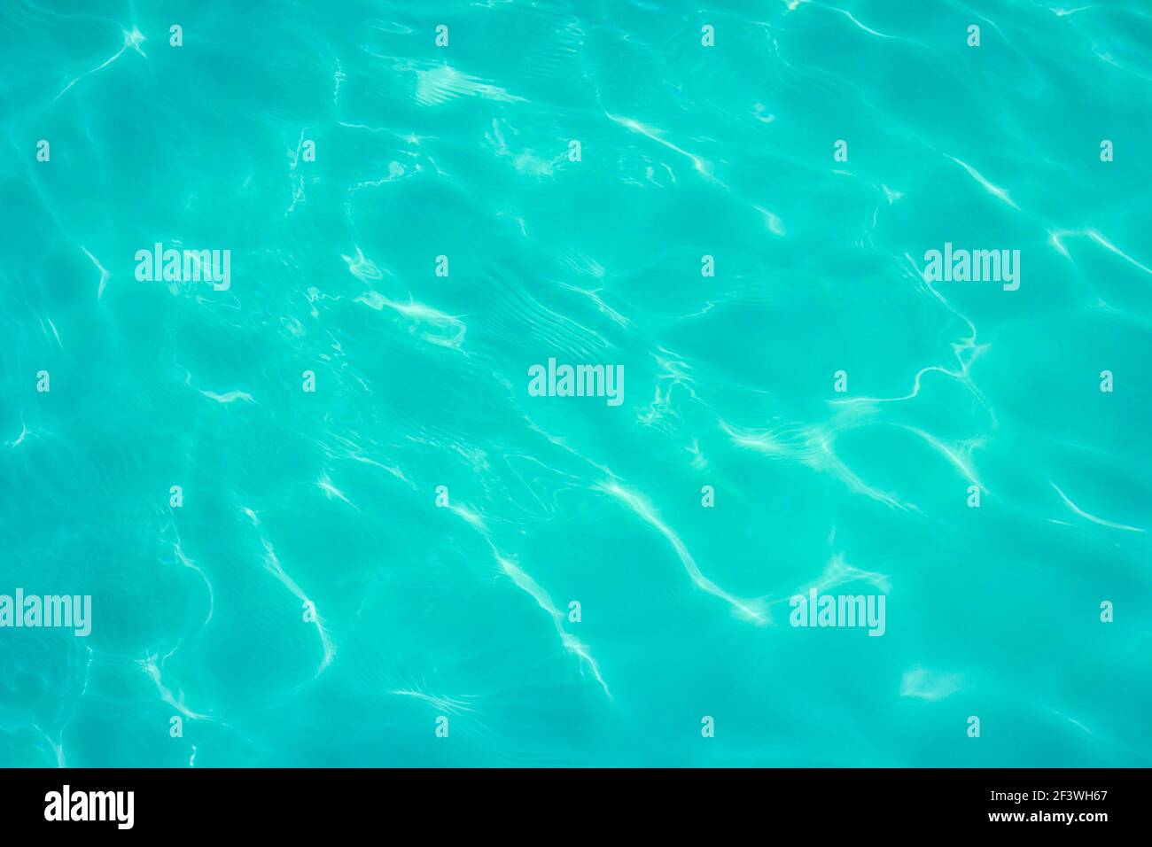 swimming pool with sunny reflections background Stock Photo - Alamy