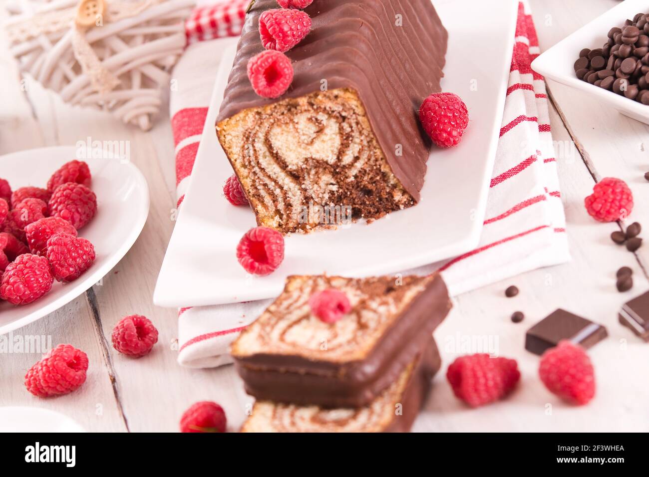 Marble cake with raspberries Stock Photo - Alamy