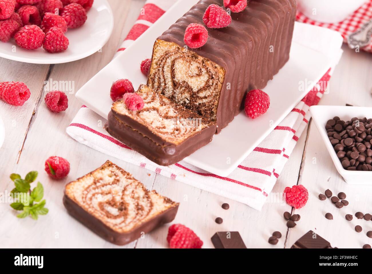 Marble cake with raspberries Stock Photo - Alamy