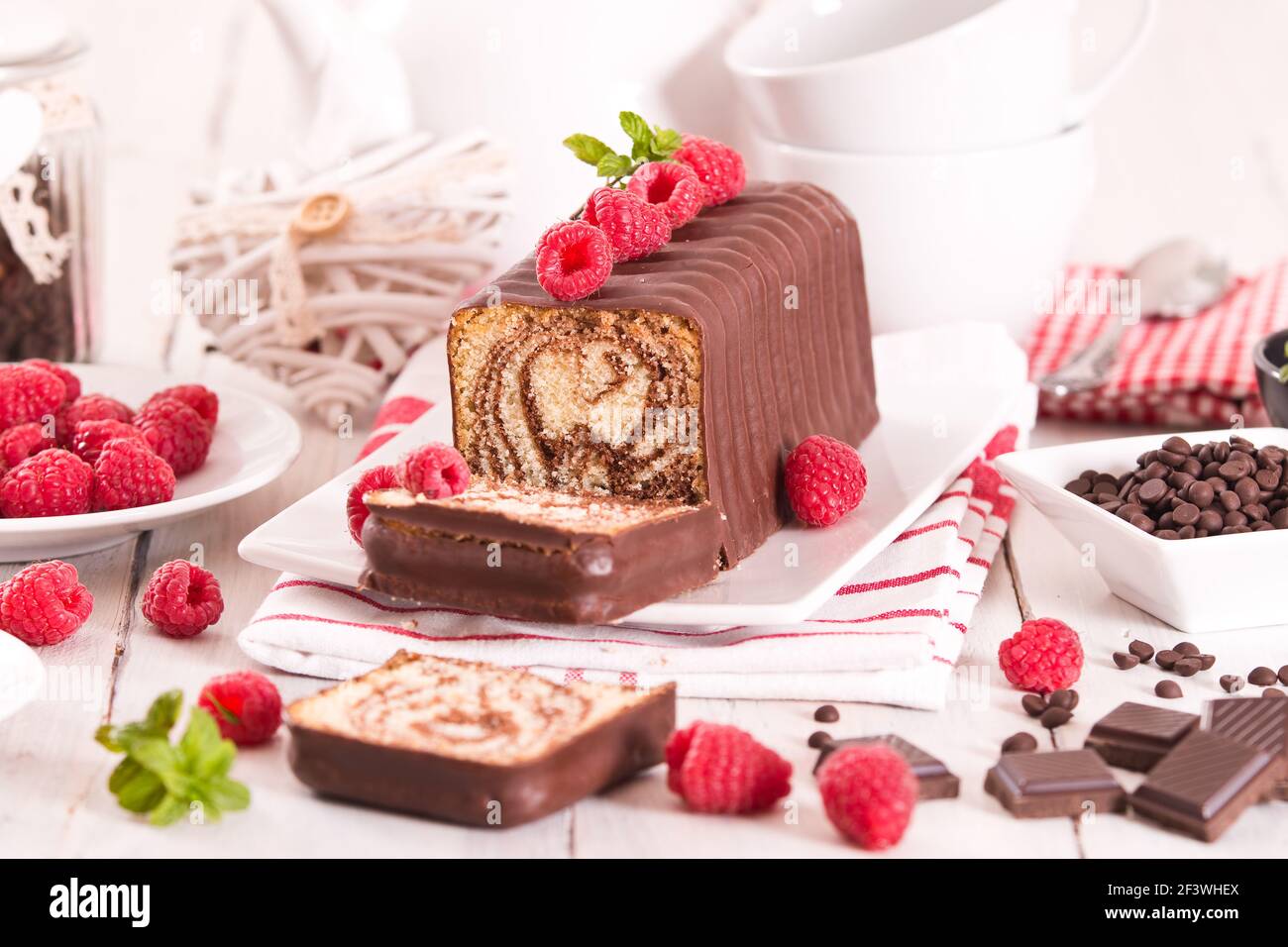 Marble cake with raspberries Stock Photo - Alamy