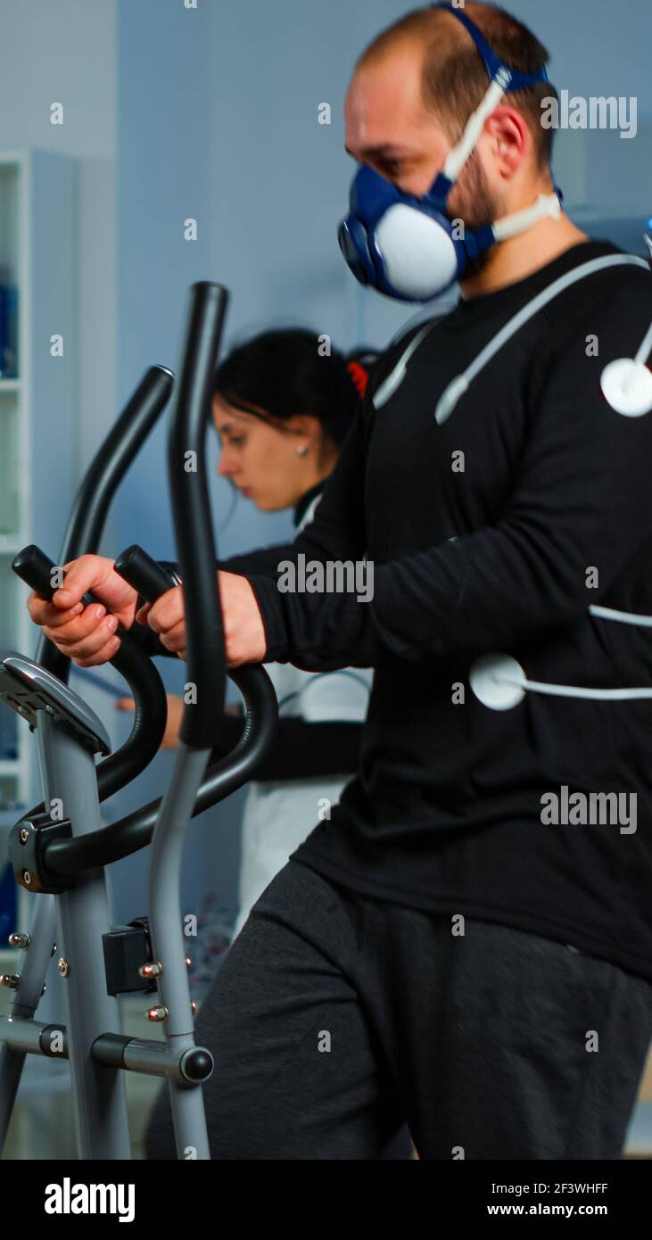Science sport doctor asking patient about his health while sportsman ...