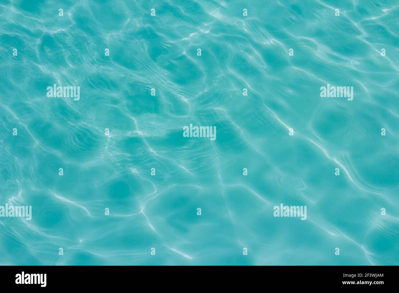 swimming pool with sunny reflections background Stock Photo - Alamy