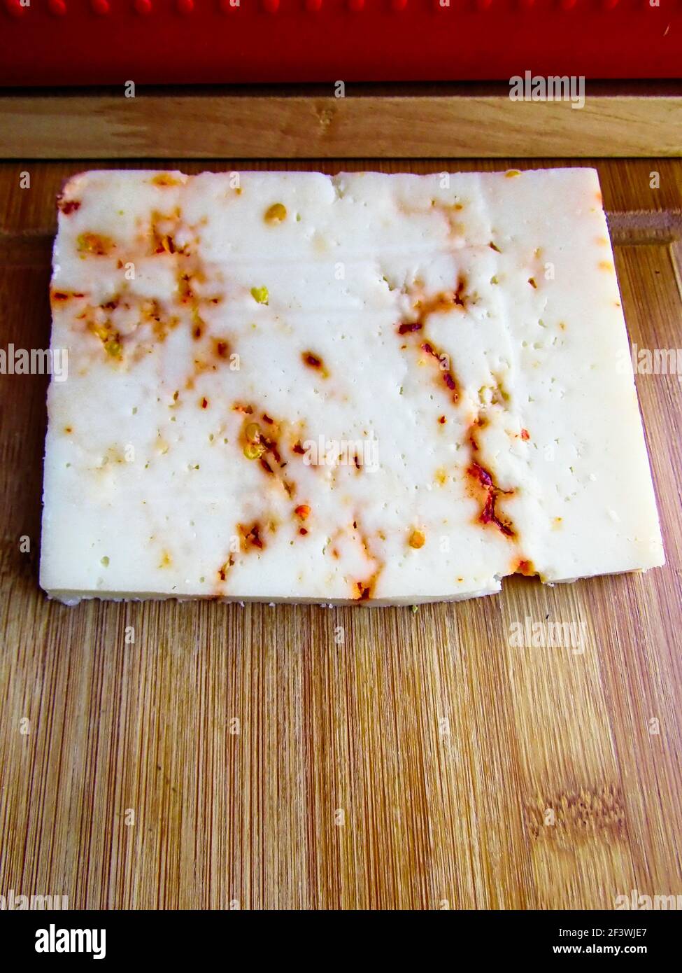 Greek Cuisine. Cretan Graviera Cheese with Chilli Stock Photo - Alamy