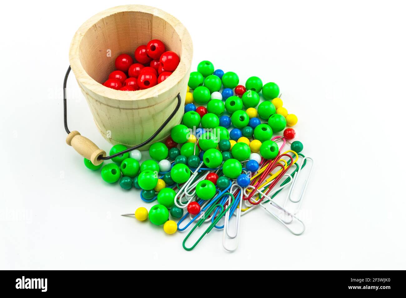 Colorful pin and paper clip in wooden casks on white background Stock ...