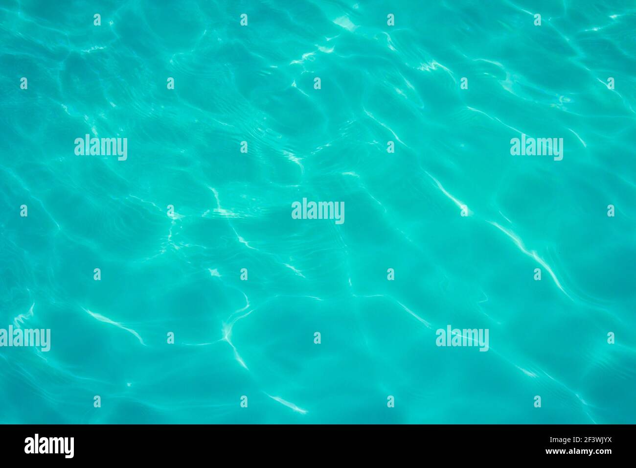 swimming pool with sunny reflections background Stock Photo - Alamy