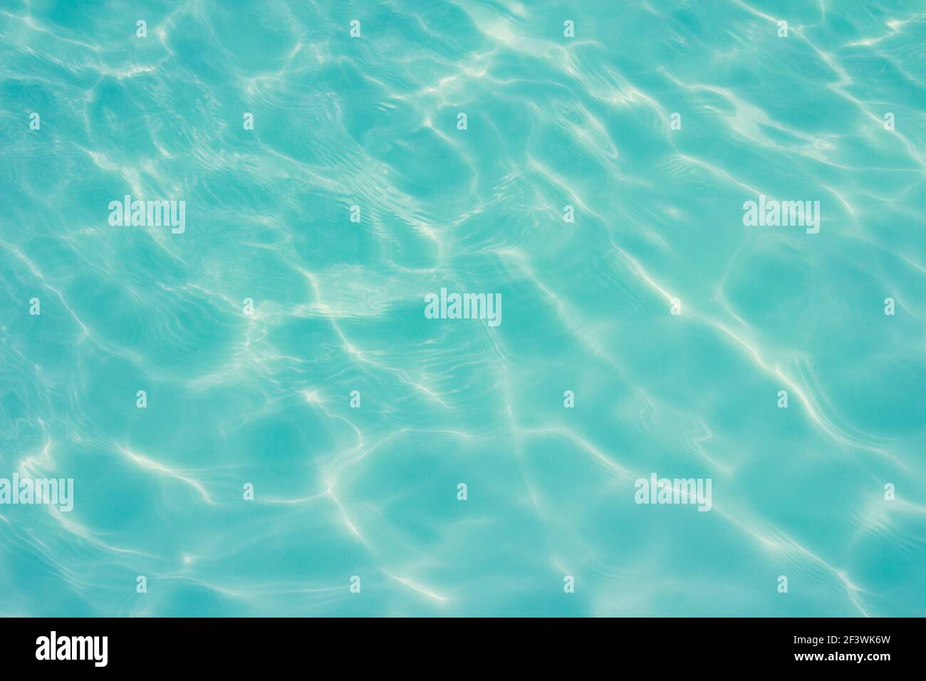 swimming pool with sunny reflections background Stock Photo - Alamy