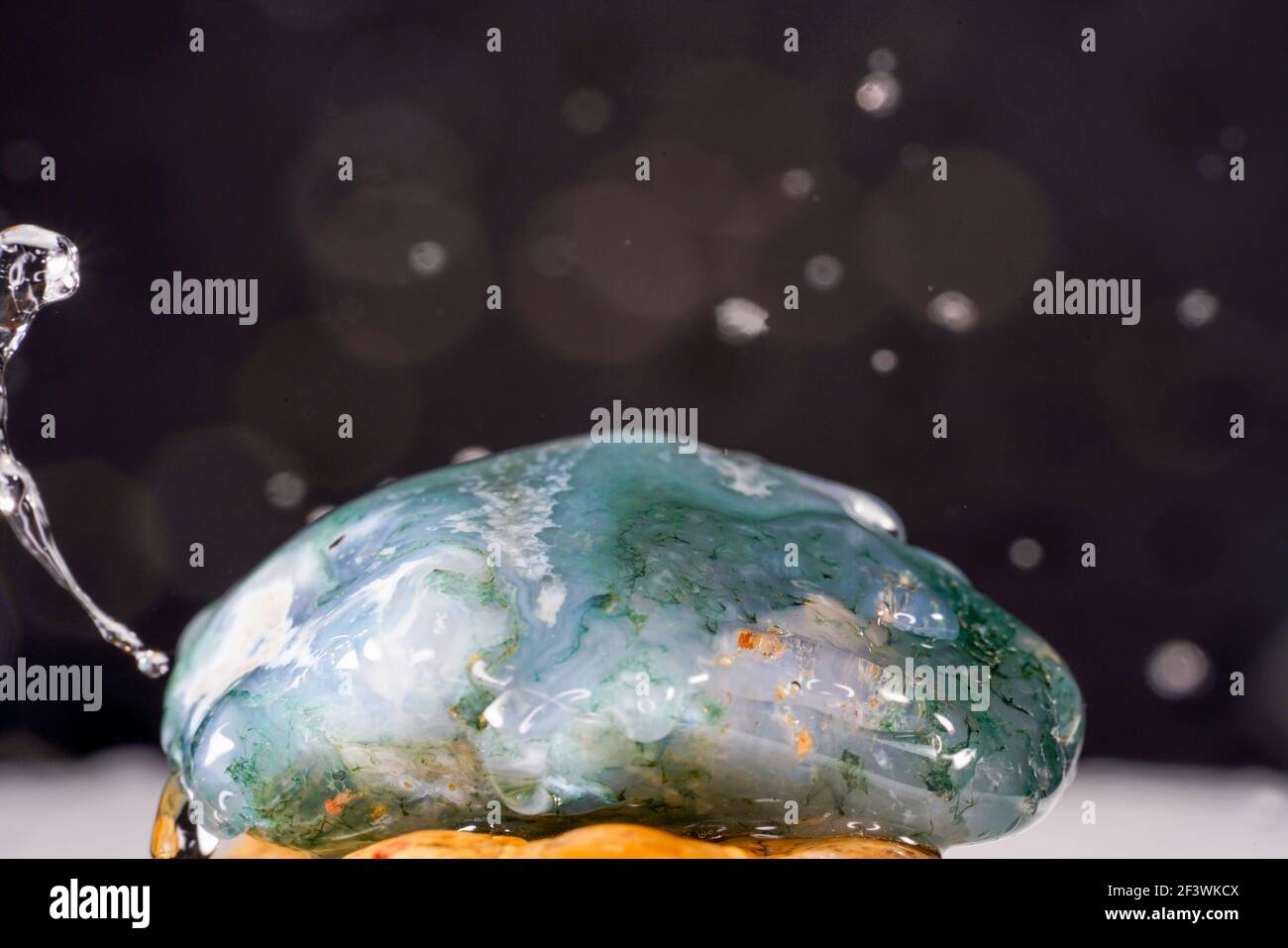 A mineral stone on bokeh background Stock Photo - Alamy