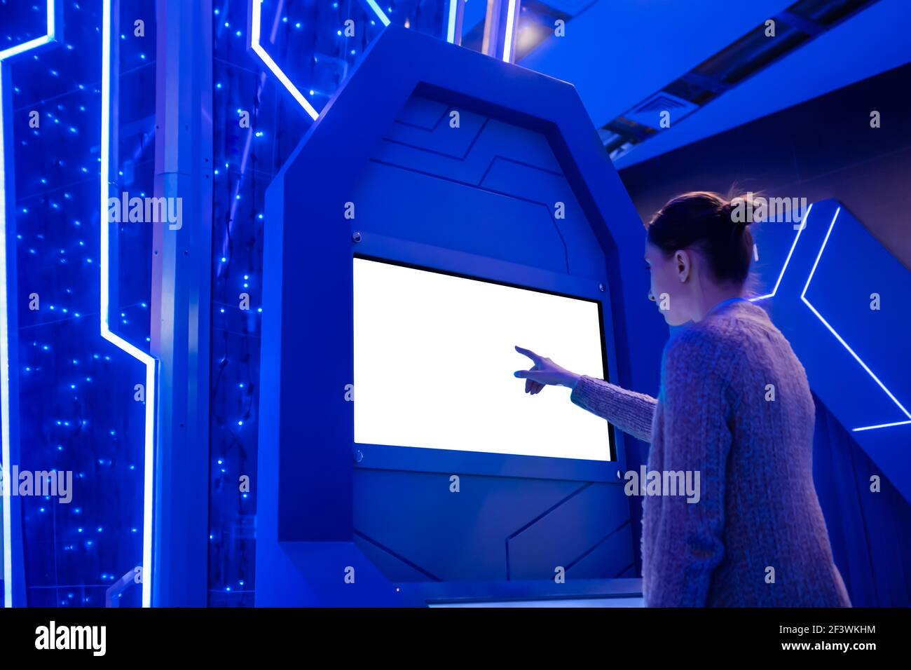 Woman hand using white blank interactive touchscreen display of ...