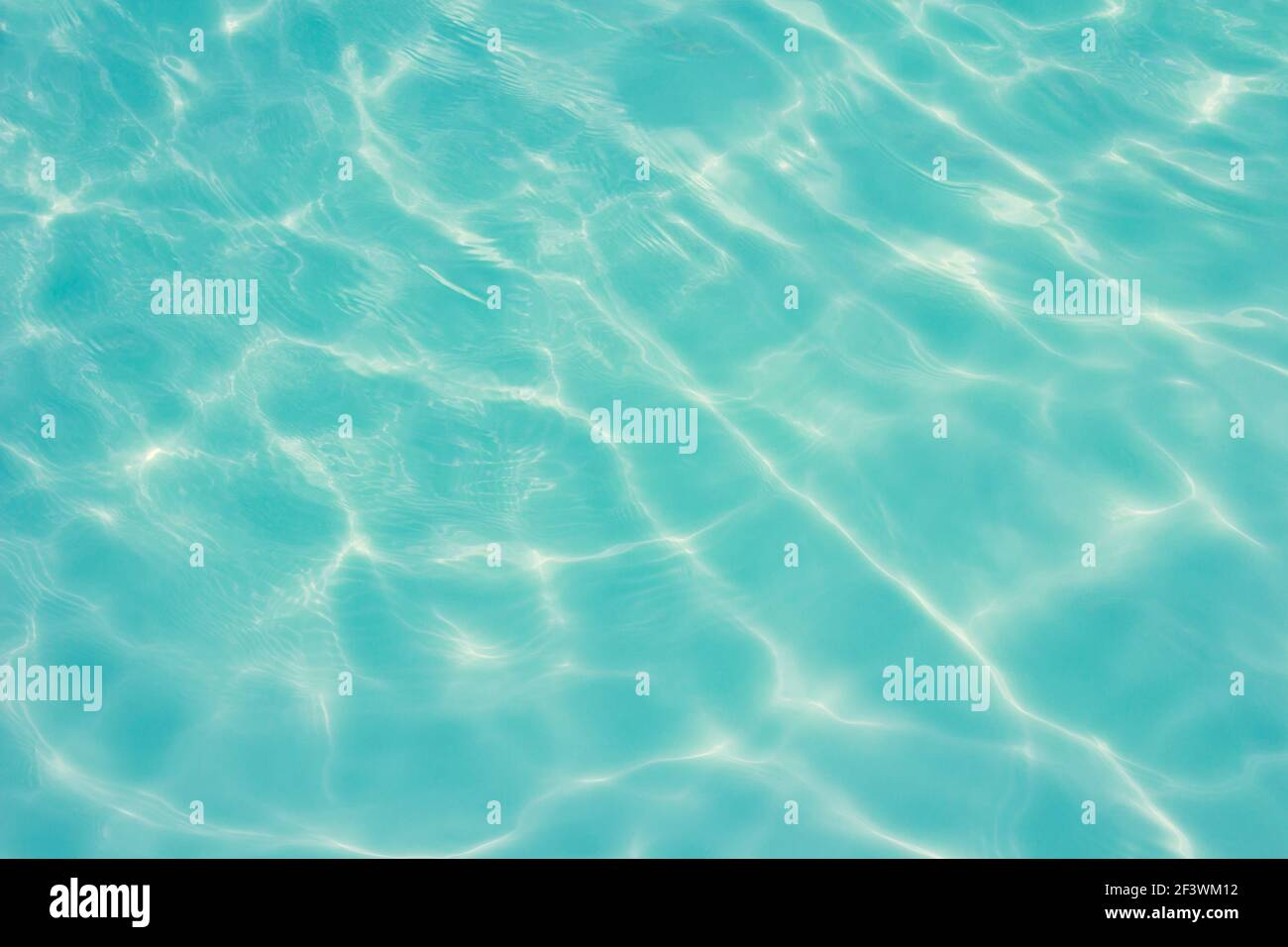 swimming pool with sunny reflections background Stock Photo - Alamy