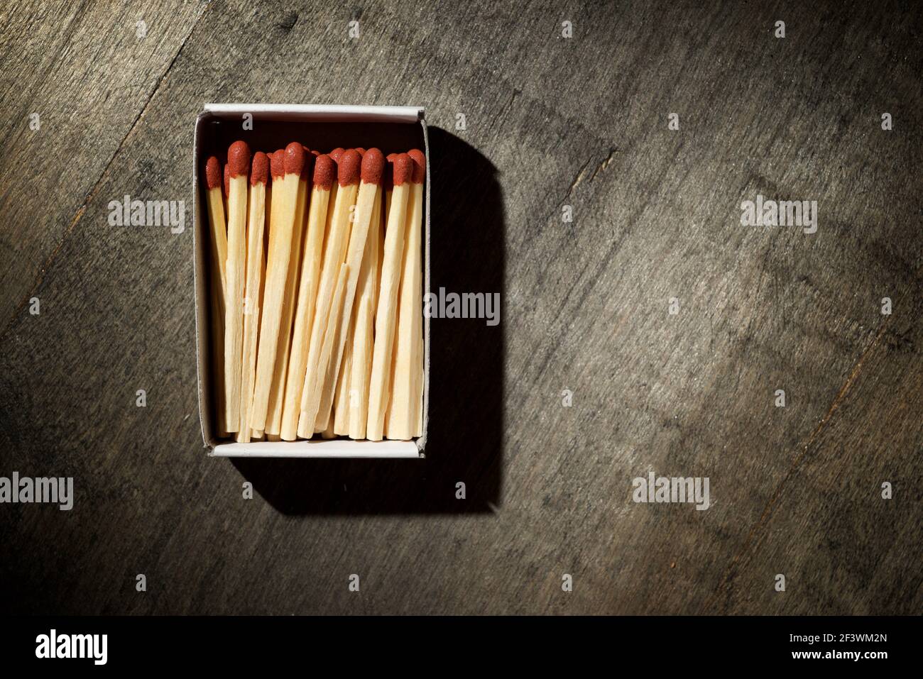 Matches on a wood table Stock Photo - Alamy