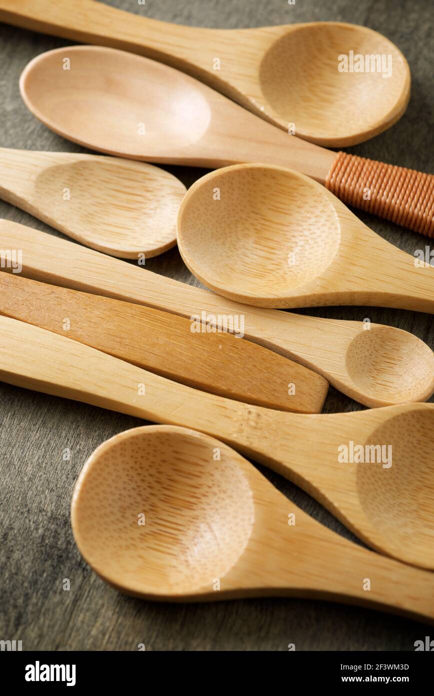 Collection of spoons on a wood table Stock Photo - Alamy