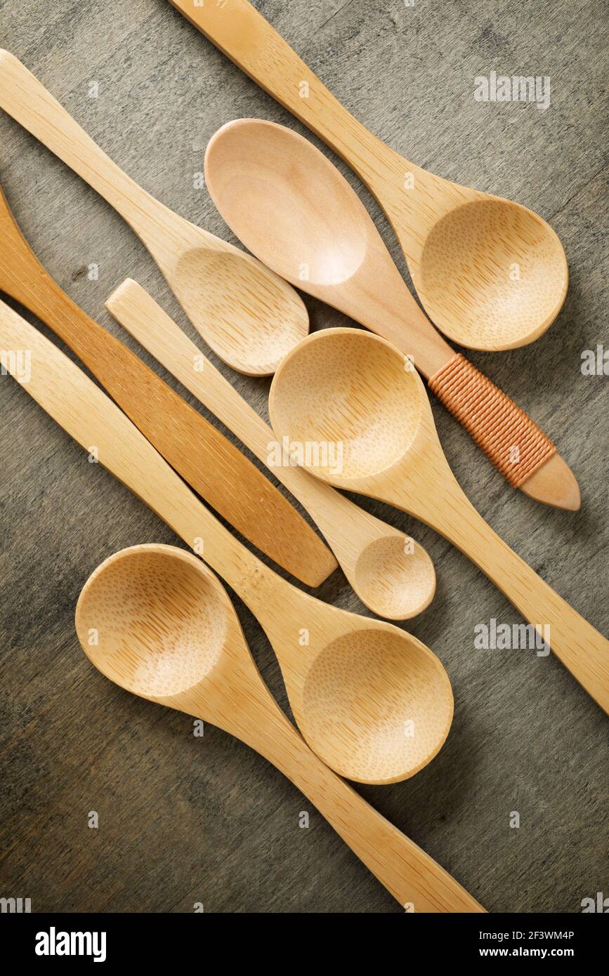 Collection of spoons on a wood table Stock Photo - Alamy