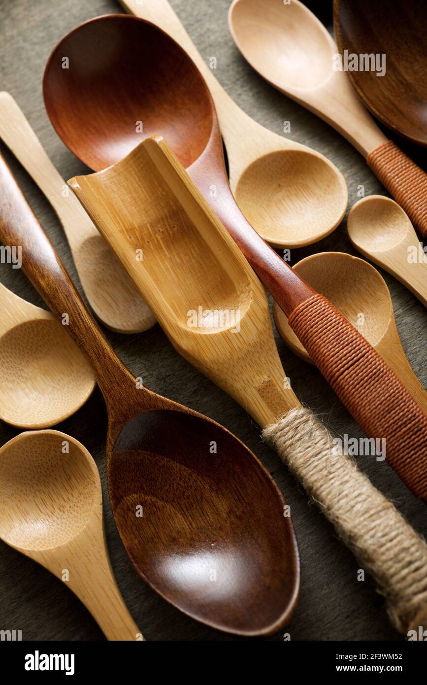 Collection of spoons on a wood table Stock Photo - Alamy