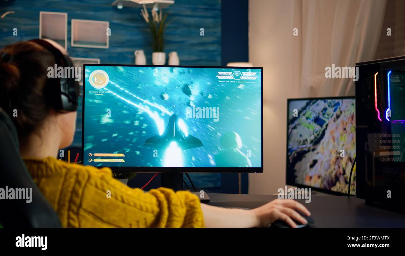Pro cyber sport gamer playing game with RGB keyboard and mouse. Virtual ...