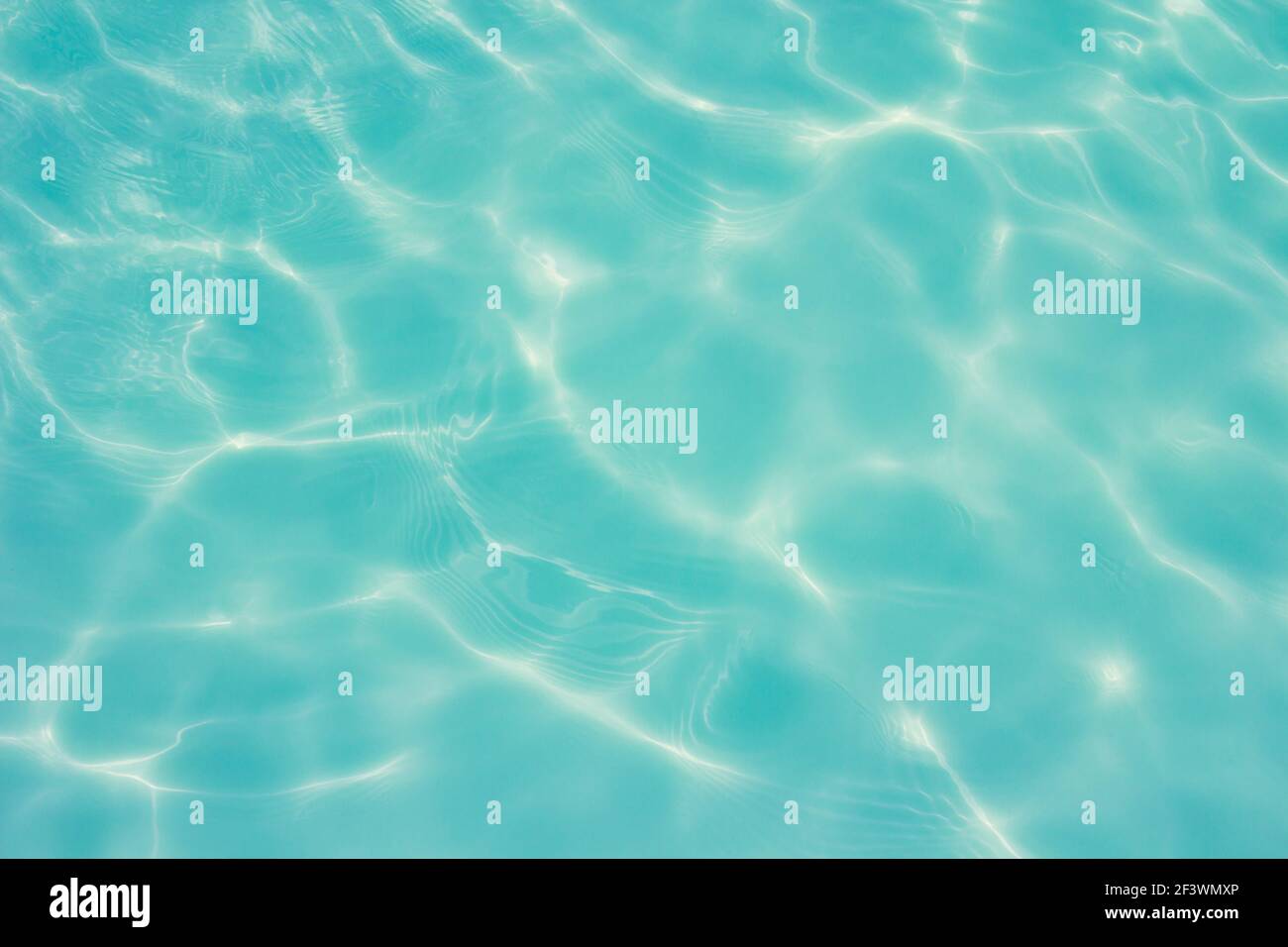 swimming pool with sunny reflections background Stock Photo - Alamy