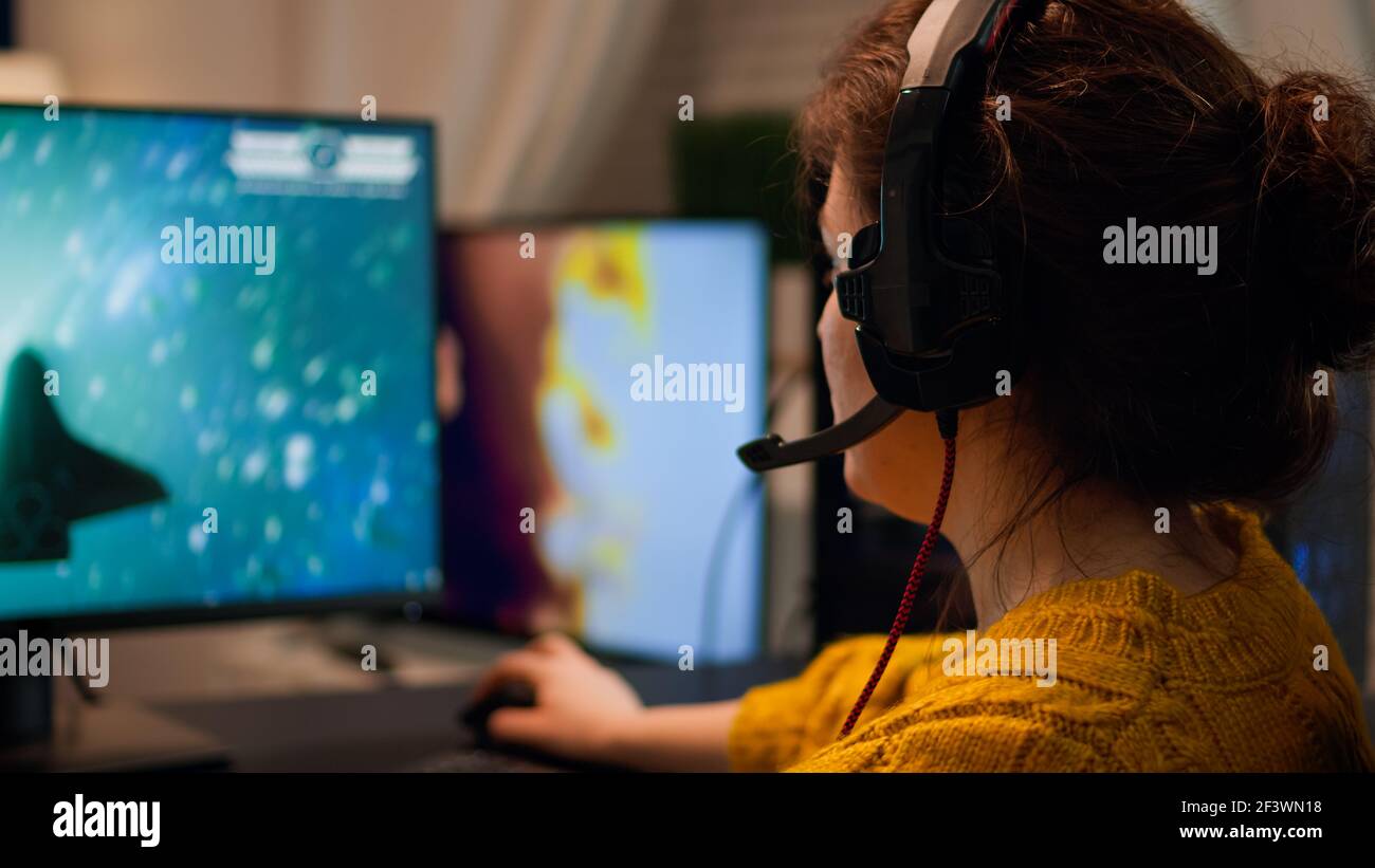 Gamer playing video game on championship discussing with teammates ...